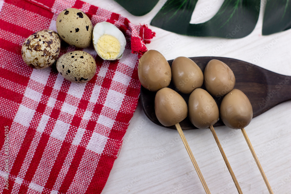Quail egg satay is satay derived from quail eggs which are seasoned and ...
