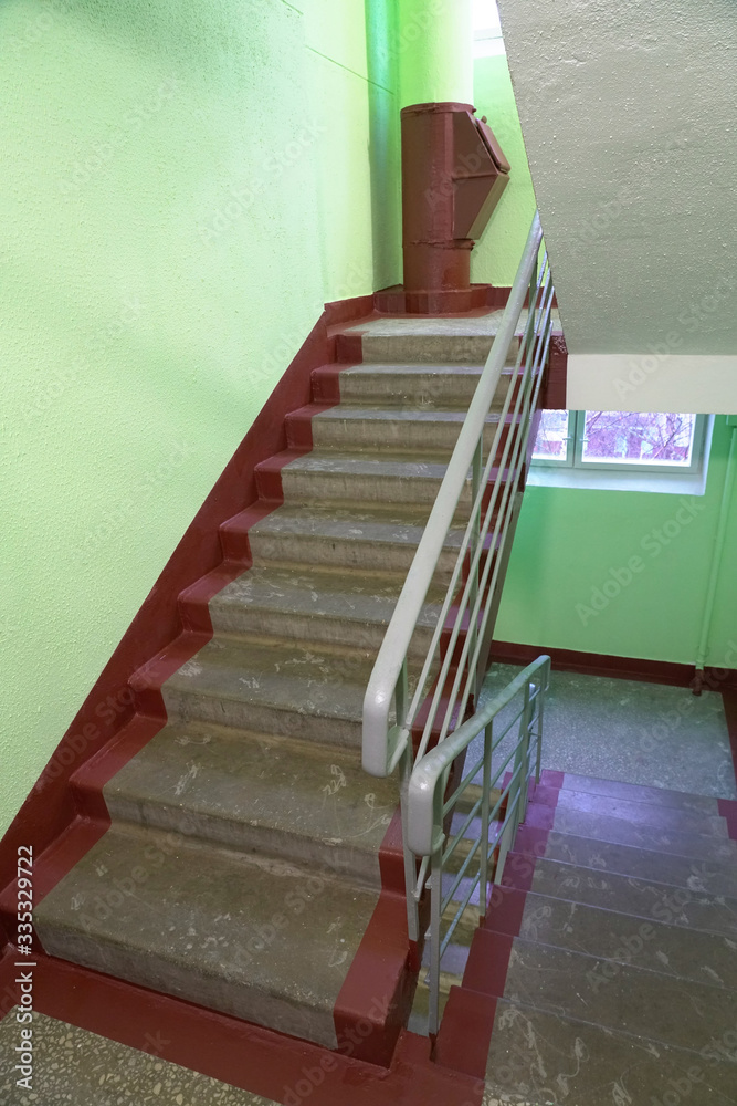 Staircase with a garbage chute inside a residential apartment building ...