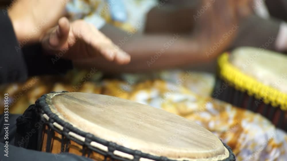 Man playing on a Bongo drum close up. Hand tapping a Bongo drum in ...