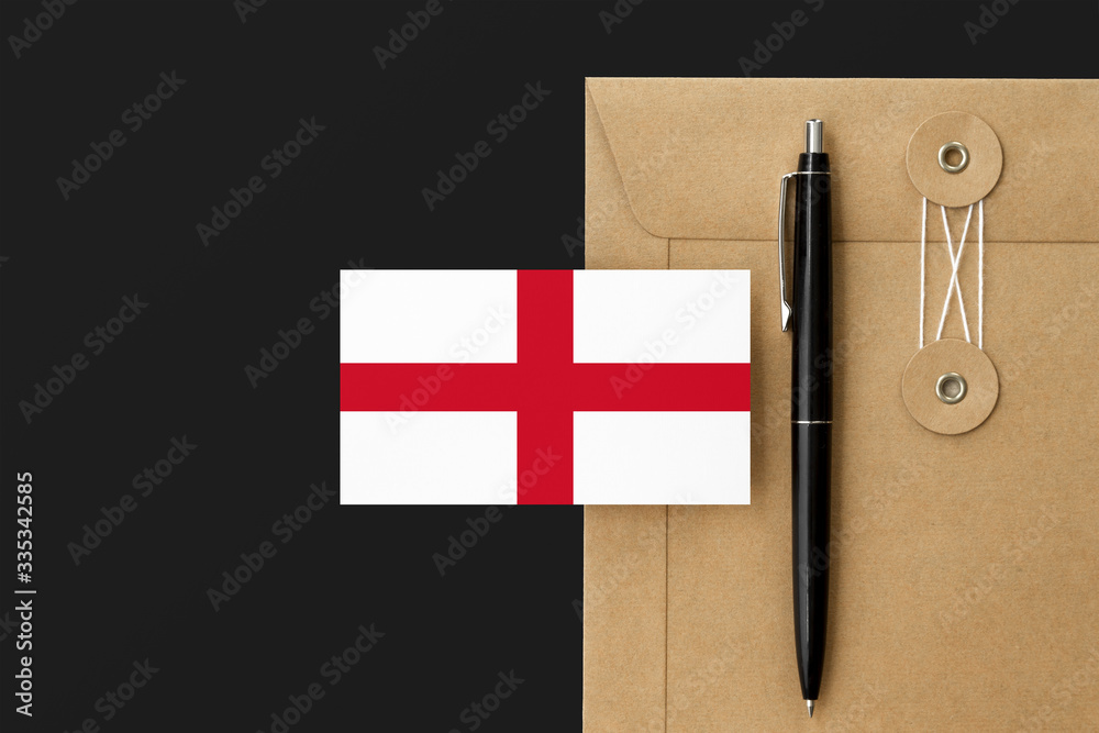 England flag on craft envelope letter and black pen background ...