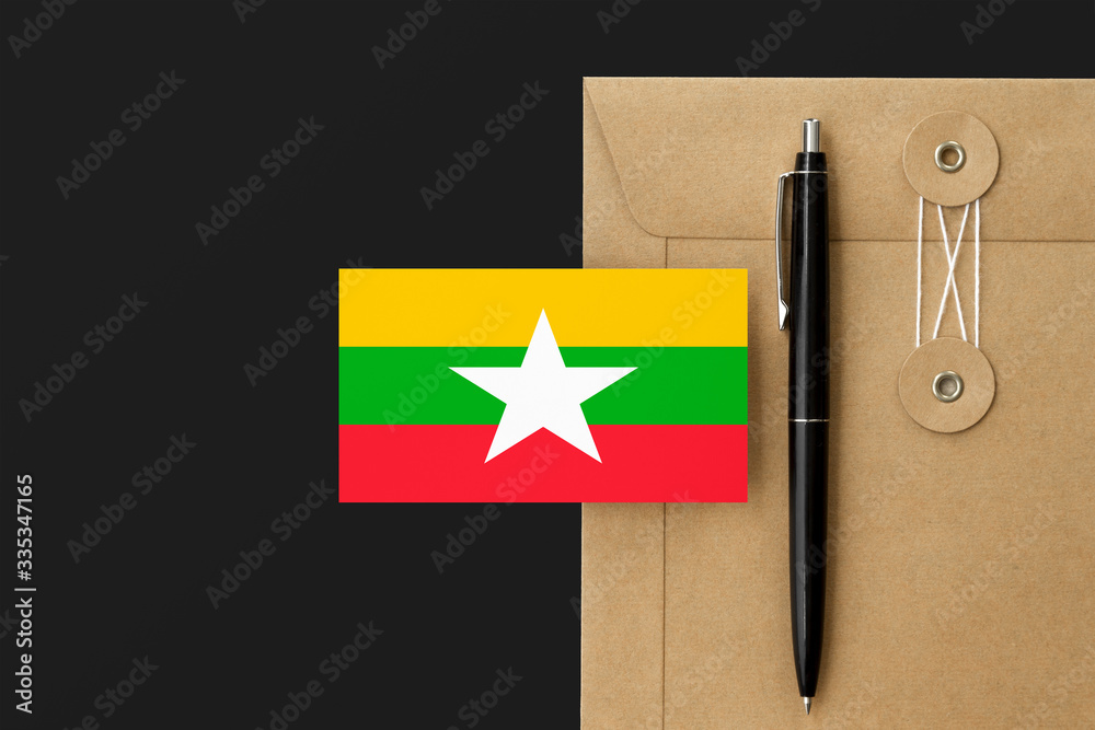 Myanmar flag on craft envelope letter and black pen background ...
