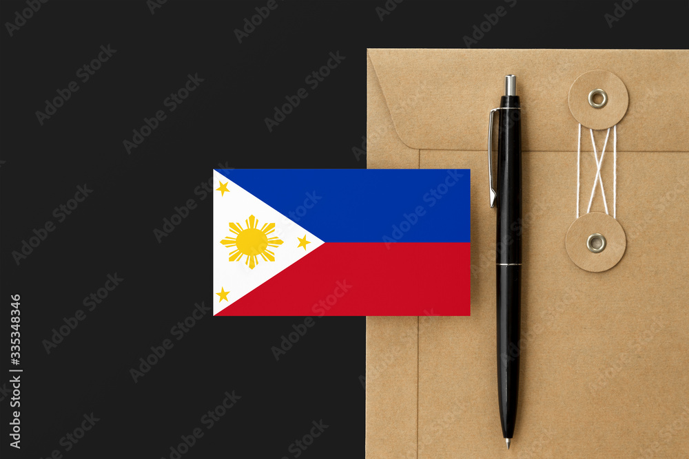 Philippines flag on craft envelope letter and black pen background ...