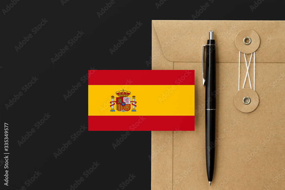 Spain flag on craft envelope letter and black pen background. National ...