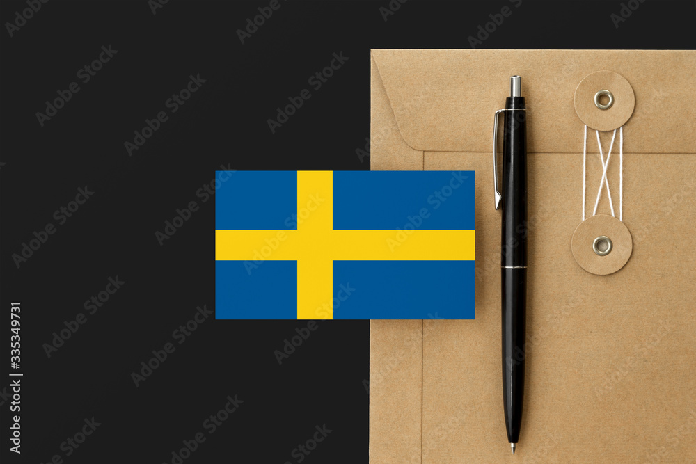 Sweden flag on craft envelope letter and black pen background. National ...