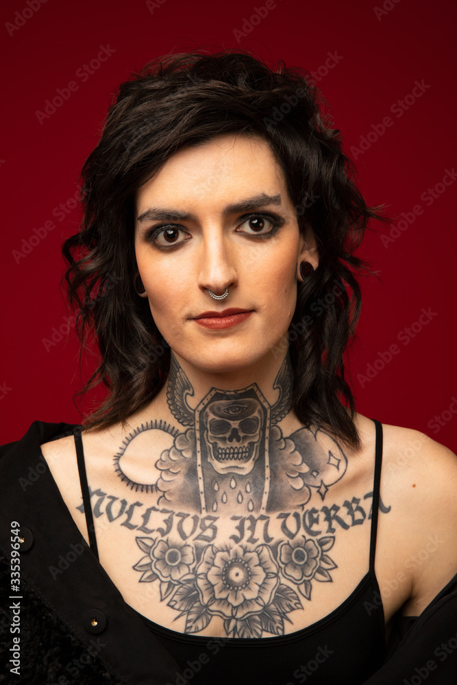 Portrait of transgender woman with chest tattoos and piercings Stock ...