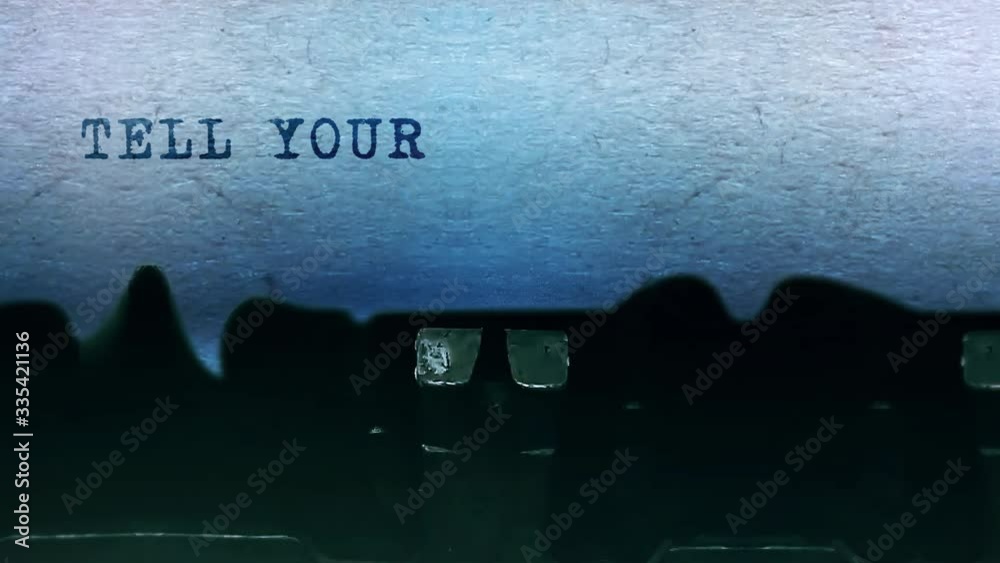 TELL YOUR STORY Word closeup Being Typing and Centered on a Sheet of ...