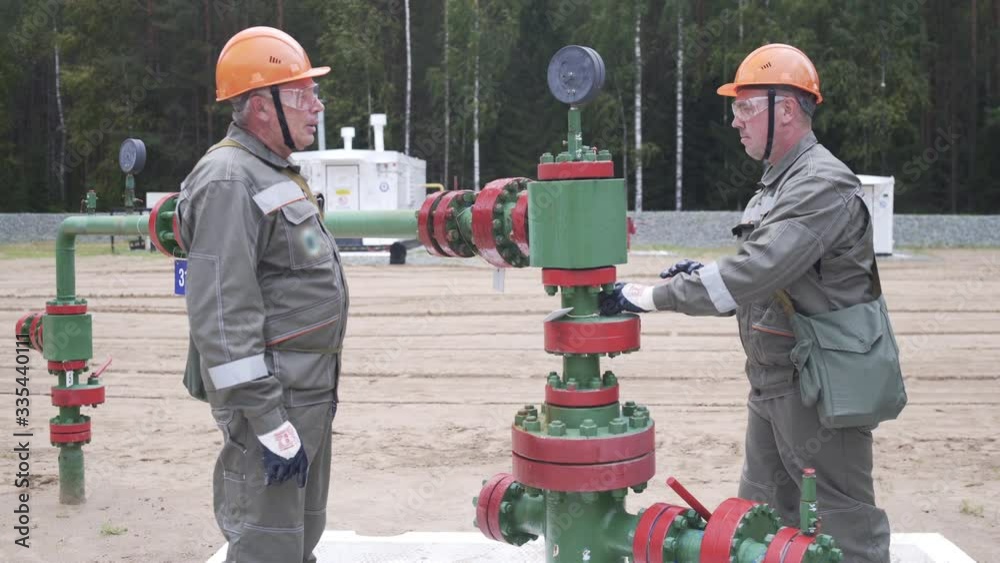 Man oil engineer overseeing Cross type X-mass tree destined for ...