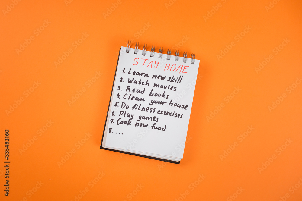 Notepad with stay home check list on covid 19 quarantine. Stay home ...