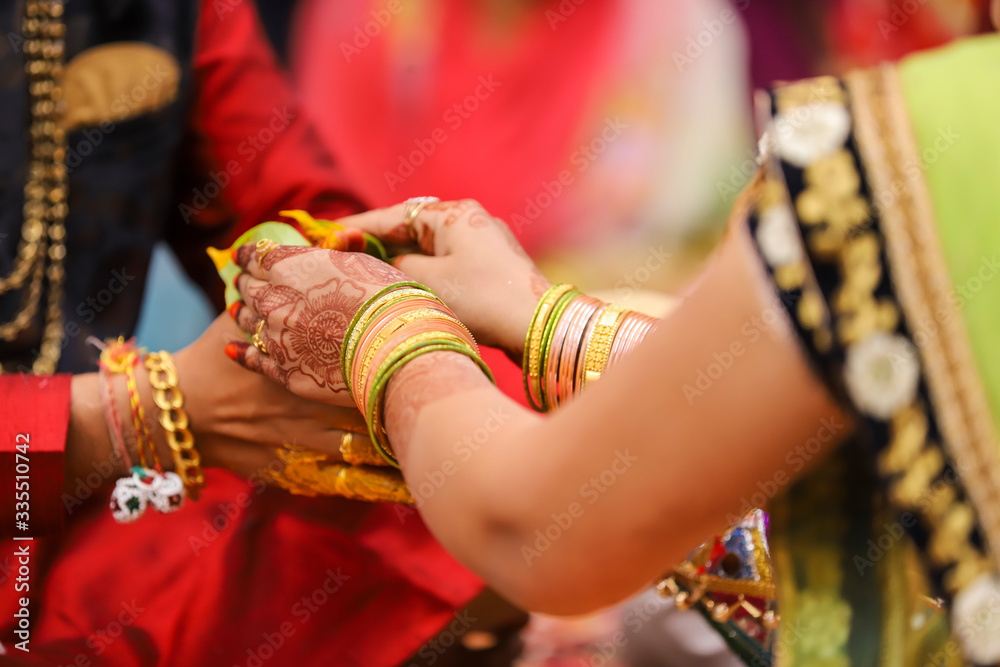 Indian wedding photography, Haldi ceremony groom hands Stock Photo ...