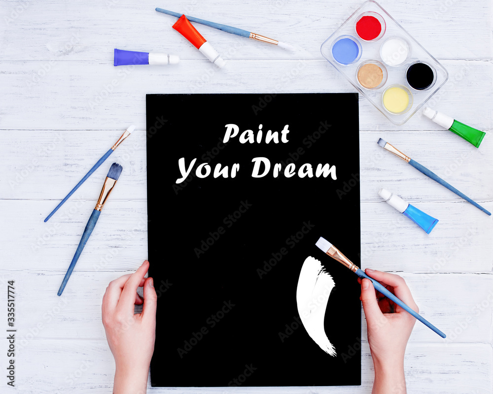 Mock up / mockup for drawing. Hands holding empty black board and brush ...