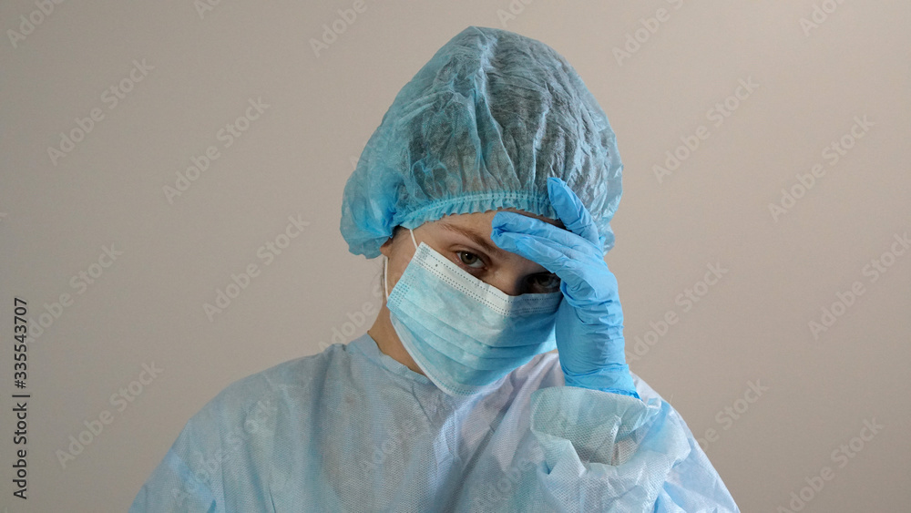 facepalm. a nurse in a medical uniform is holding a test tube with ...