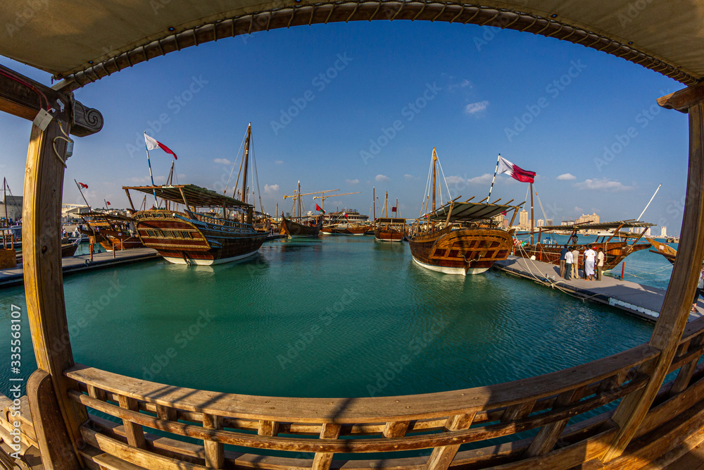 Traditional wooden boats (dhows) in Katara beach Qatar daylight view ...