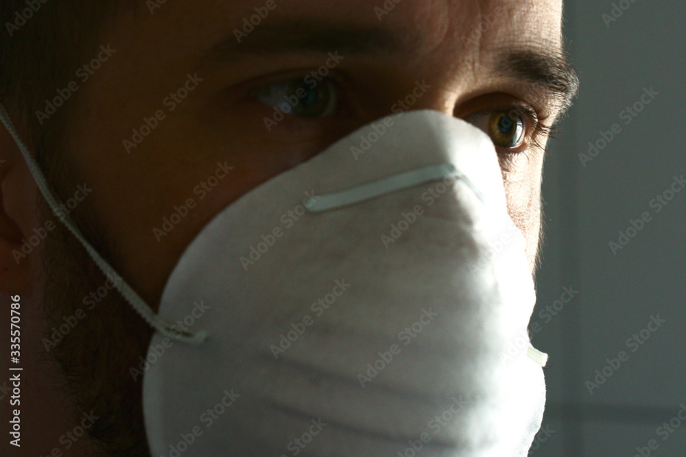 protective measures. wearing a mask over mouth and nose. young man 30 ...
