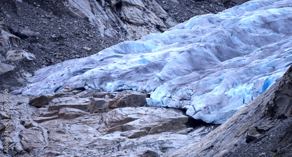 Norwegian glacier with turquoise blue ice affected by climate change ...