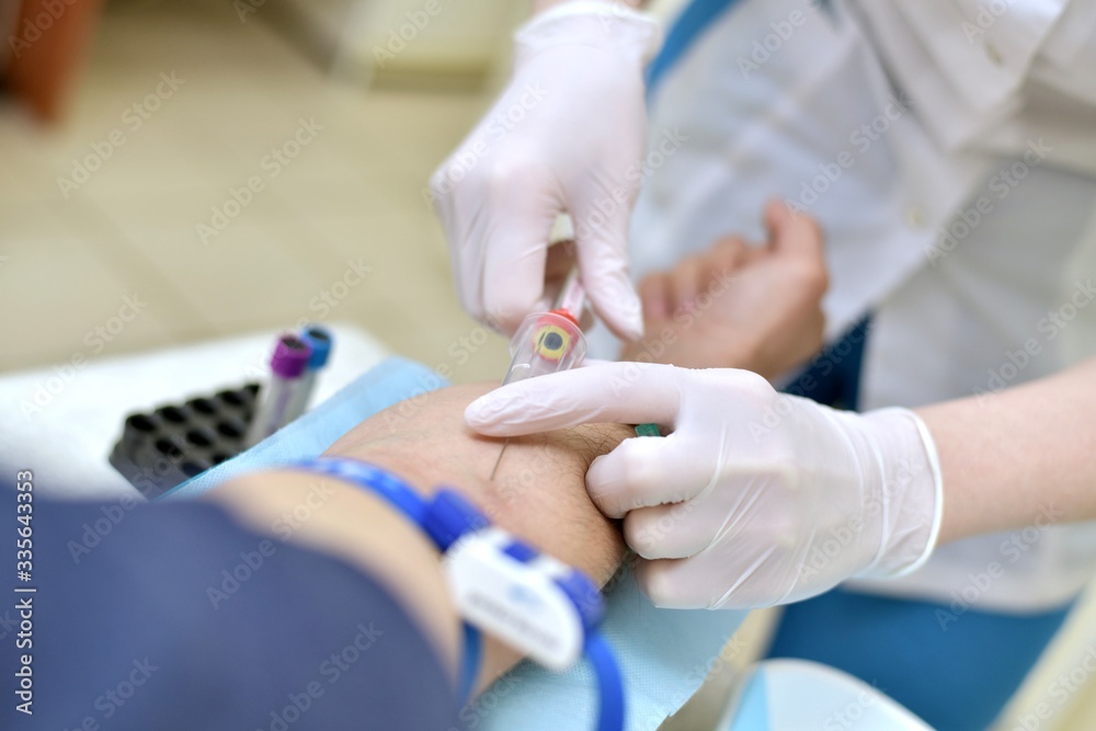 Venous blood collection from the patient in the lab. The stage of the ...