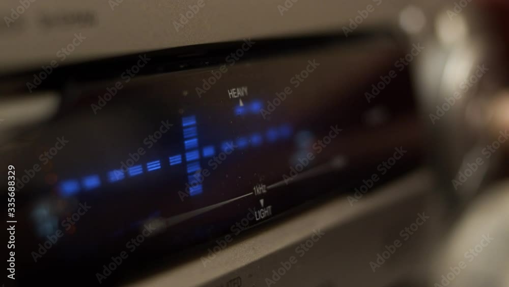 Adjusting equalizer settings on stereo sound system with led display ...