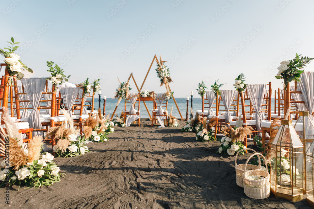 Triangular wedding arch by the sea ready for the ceremony. Wedding ...