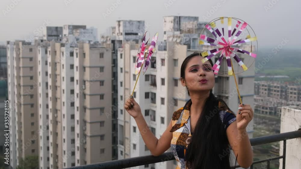 An young and attractive Indian Bengali brunette girl in western dress ...
