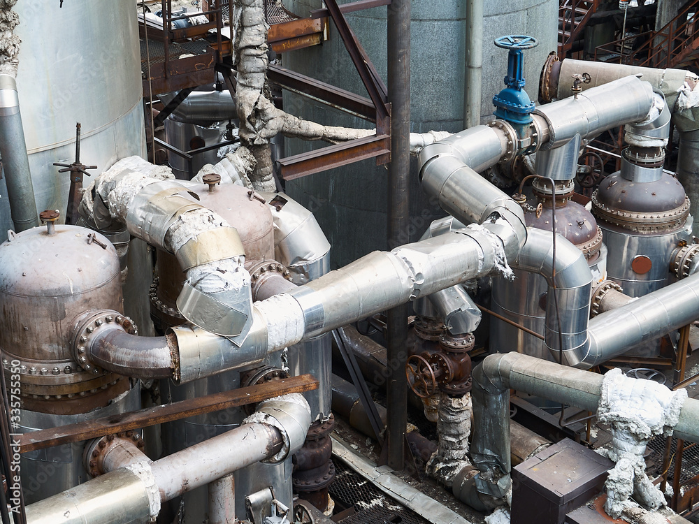 Tangle of pipes. Concept of complexity of petrochemical industry ...