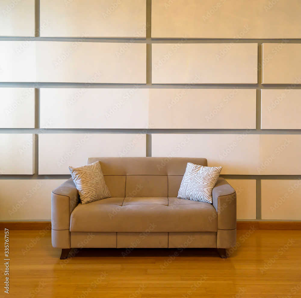 Plush seating arrangement with blank wall shot as a background for ...