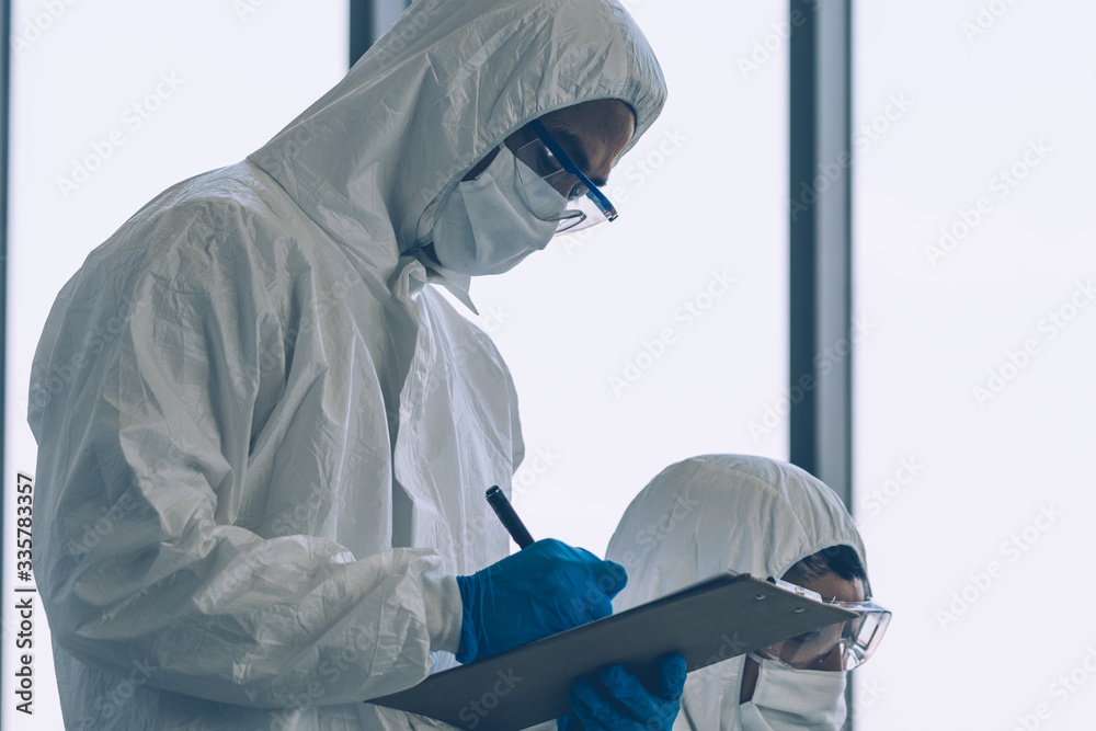 Lab Technician in Personal protective equipment PPE suit Vaccines ...