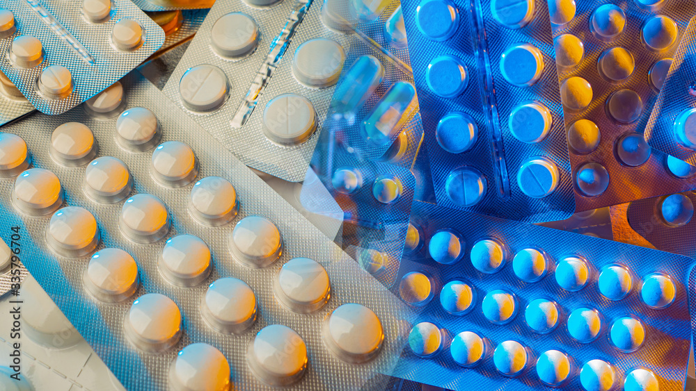 Pharmacy. Background from tablets packed in a blister. Several types of ...