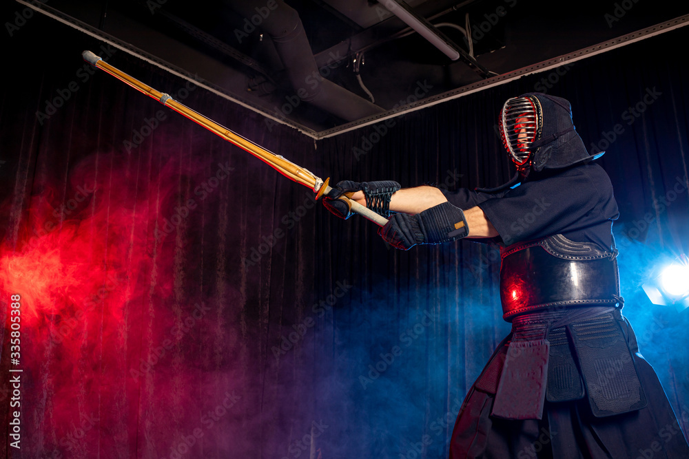 caucasian male kendo fighter with bamboo sword shinai . traditional ...
