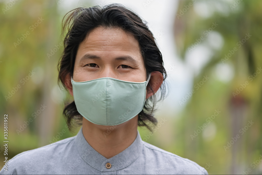 Man wearing a cloth mask in public area protect himself from risk of ...