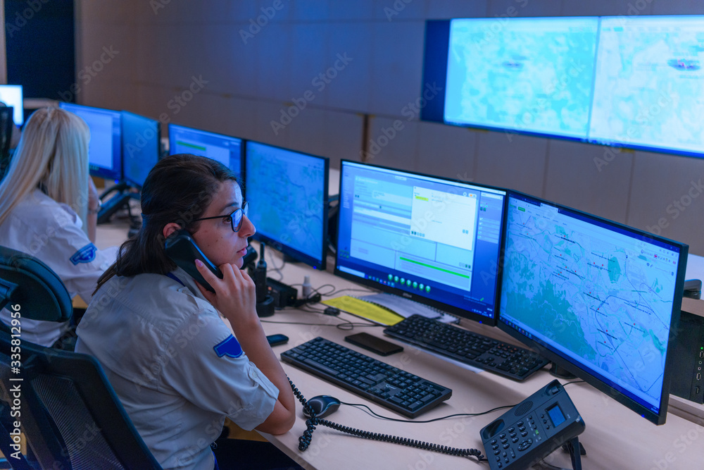Technical Operator Works at His Workstation with Multiple Displays ...