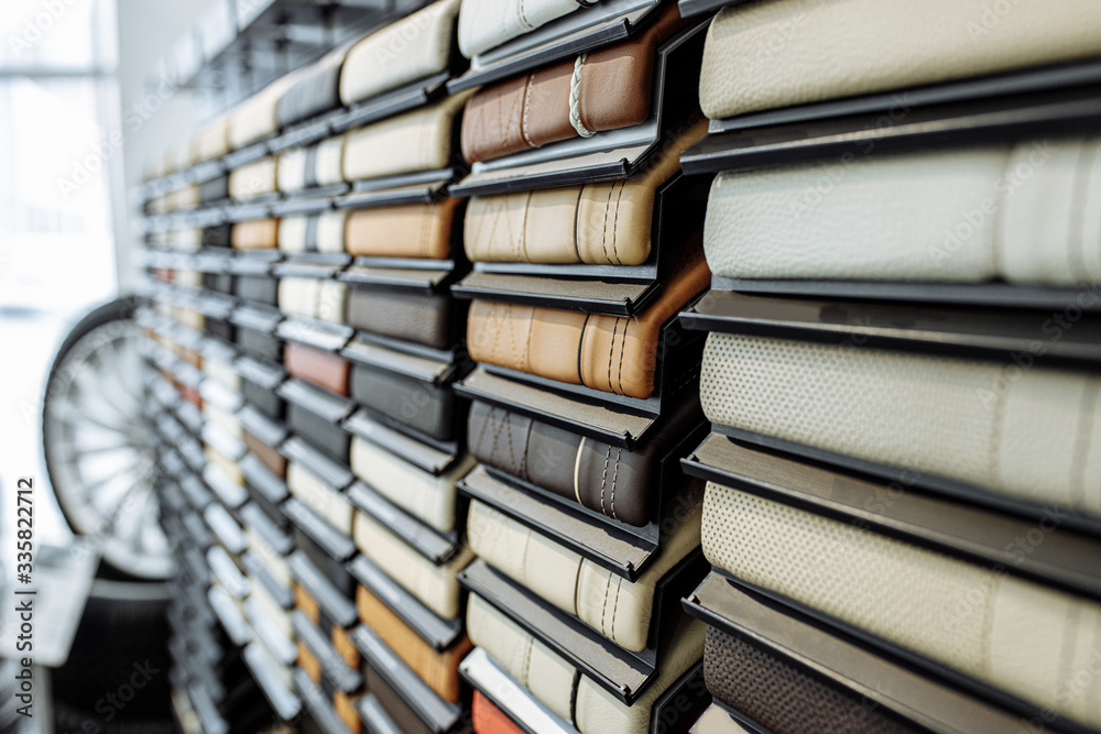 auto paint samples of different colors at car dealership showroom ...