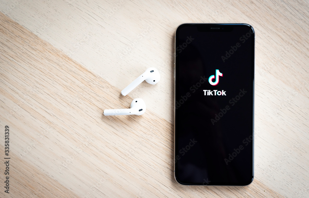 Tik Tok application icon on Apple iPhone XS Max screen close-up. Tik ...