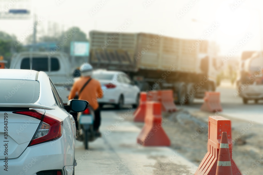 Cars driving on the road. Traffic jams with the construction road ...