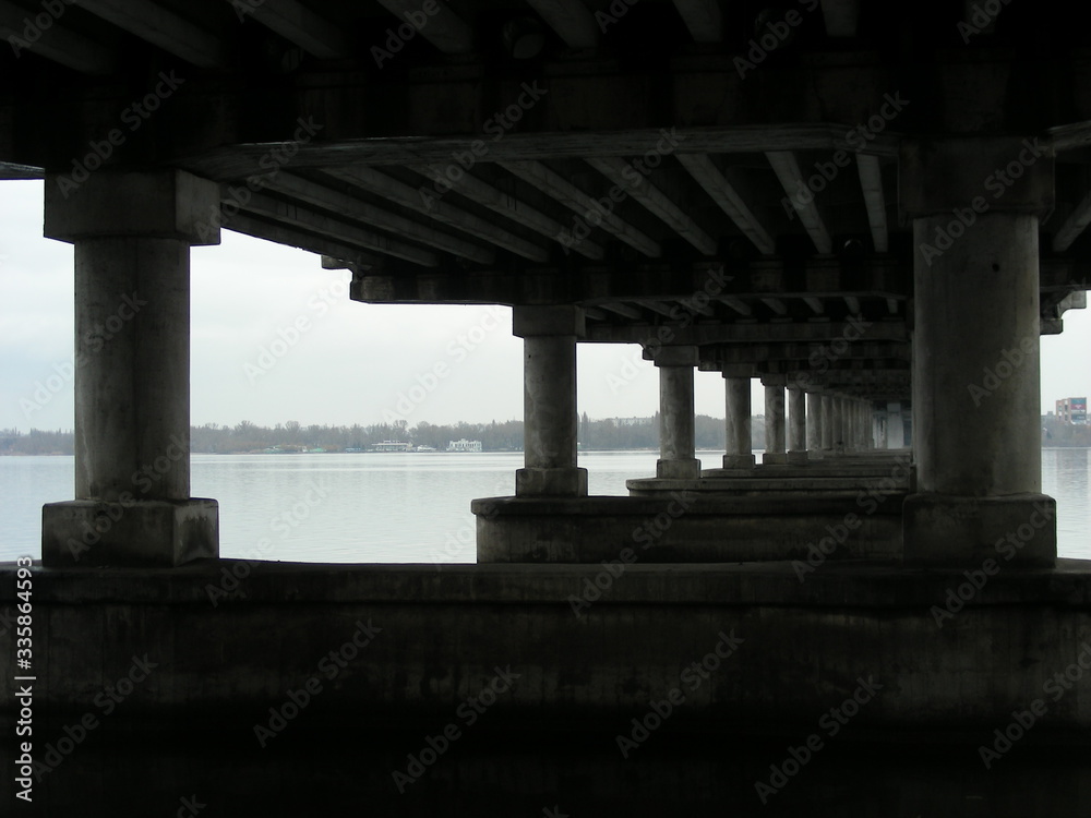 Bottom view of the reinforced concrete bridge over the river. Bridge ...