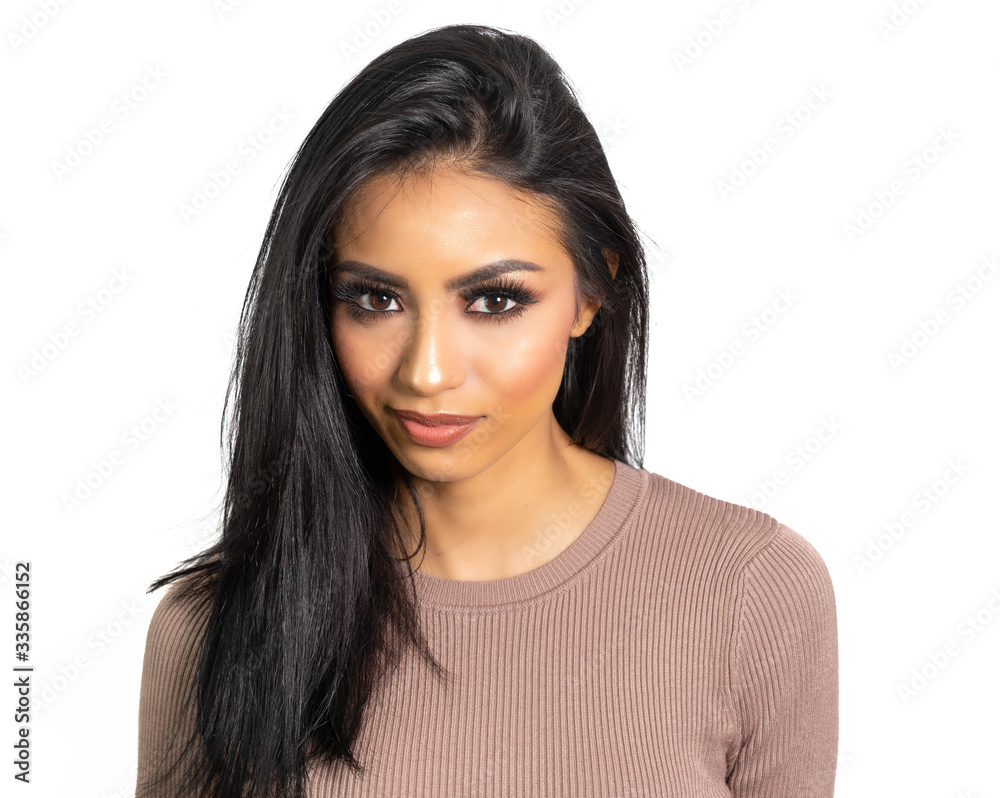 Studio shot of beautiful woman with long black hair isolated against ...