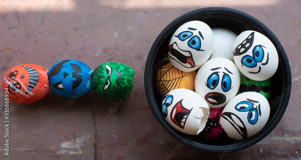 Eggshells painted as face animation to represent Corona virus and the ...