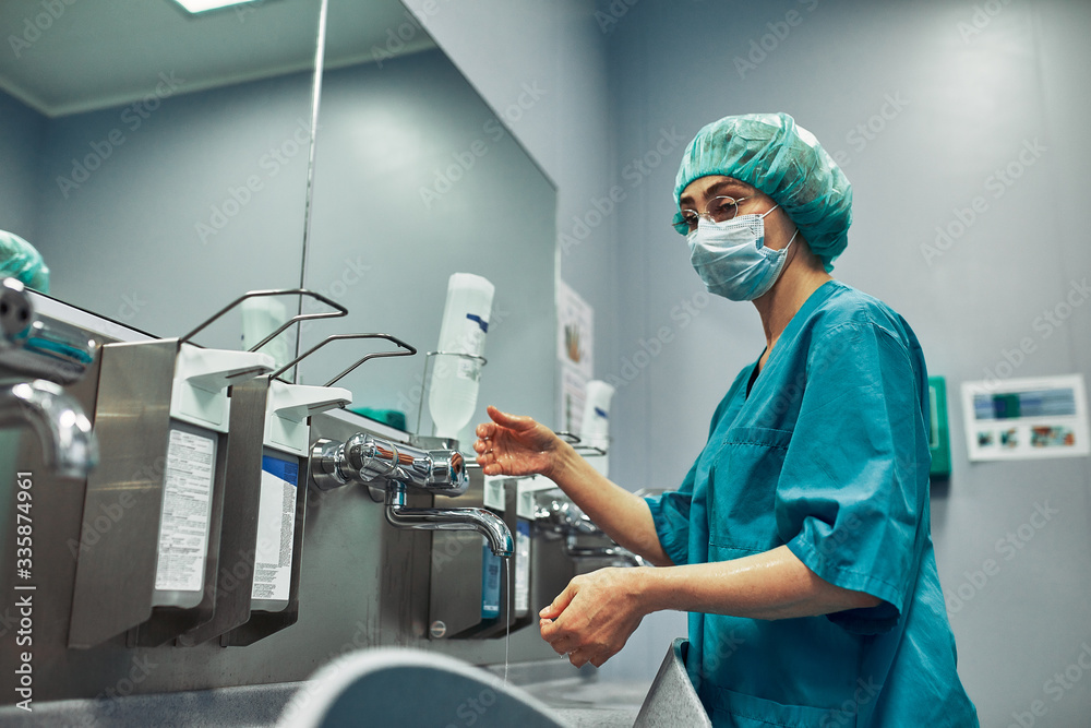 The doctor washes his hands before surgery. Sterility concept. A ...
