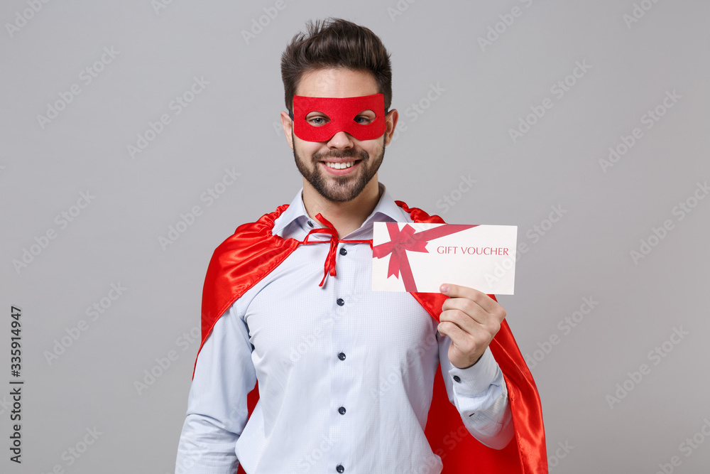 Smiling young powerful business man in light shirt superhero suit have ...