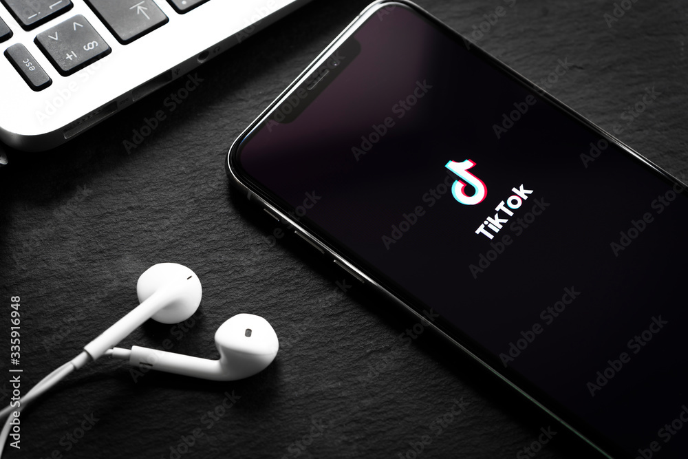 Tik Tok application icon on Apple iPhone XS Max screen close-up. Tik ...