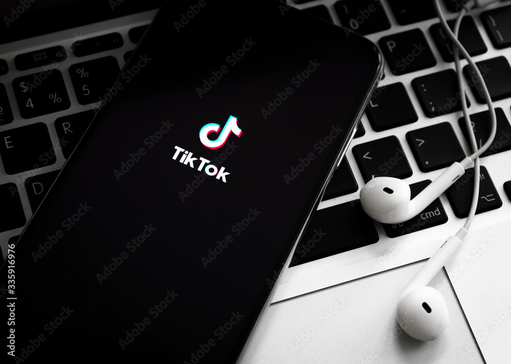 Tik Tok application icon on Apple iPhone XS Max screen close-up. Tik ...