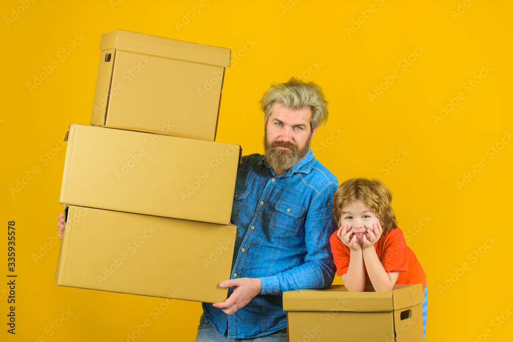 Prepare for moving. Packaging. Father and son with boxes. Family ...