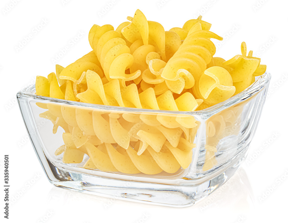 Dried italian pasta spiral Fusilli in a small transparent glass square ...