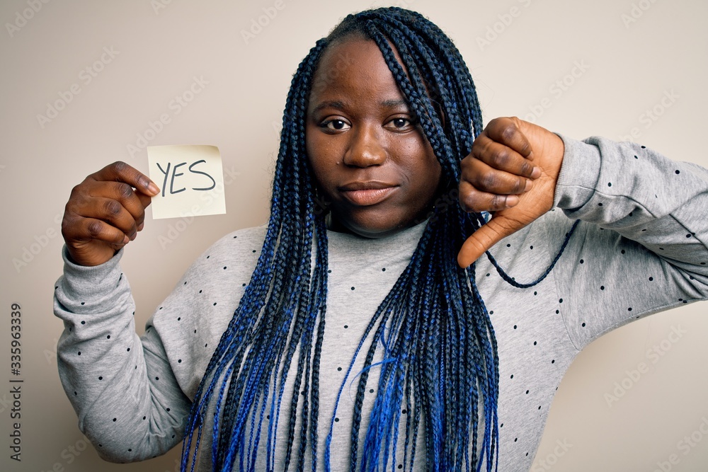 Young african american plus size woman with braids holding reminder ...