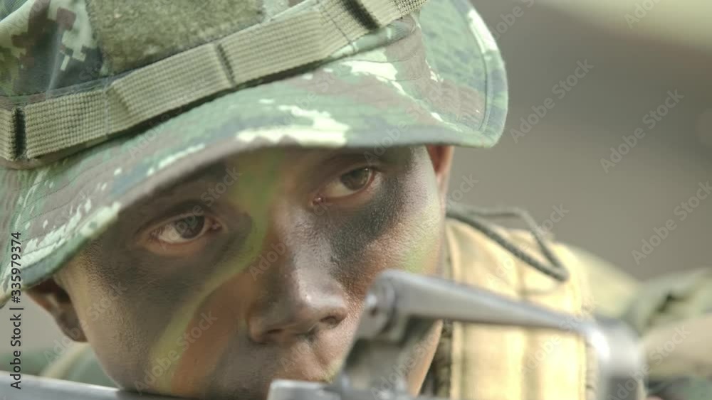 Asian army troop in war wearing military uniform and helmet painting ...