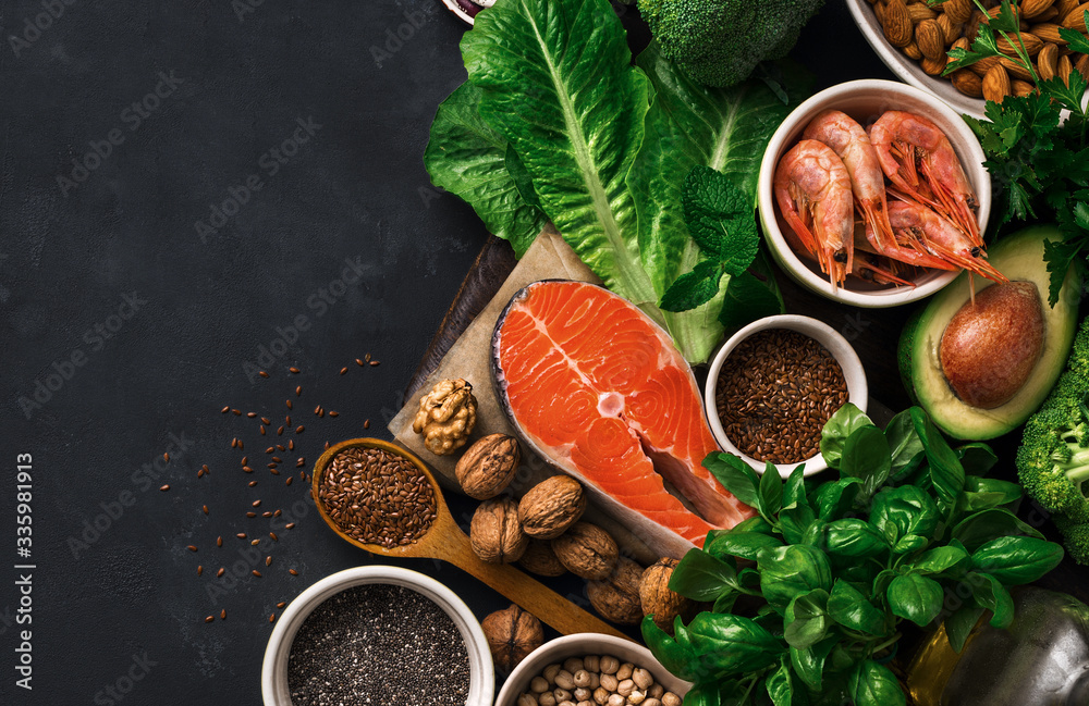 Food sources of omega 3 on dark background with copy space top view ...