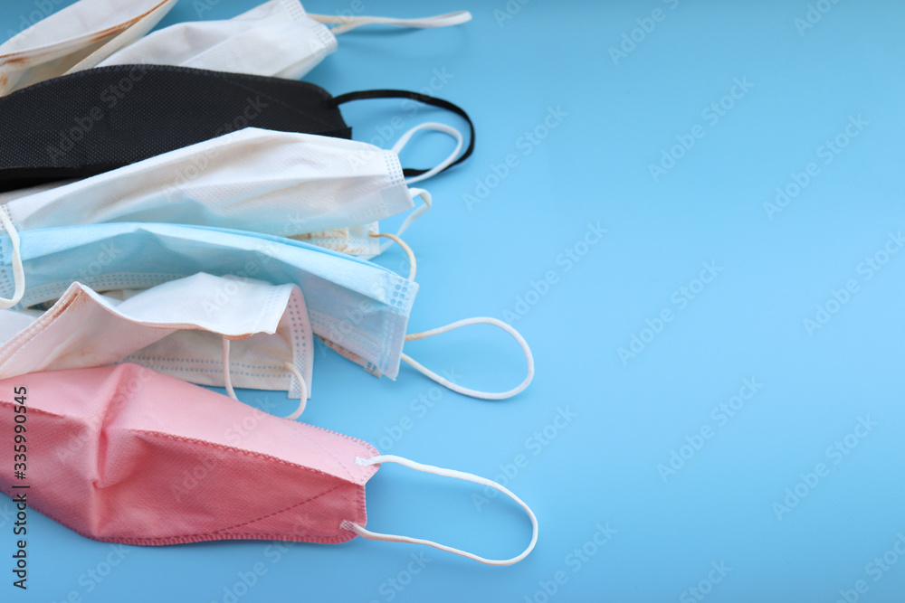 Group of Face Masks Dirty with cosmatic Hanging on the clothes hanger ...