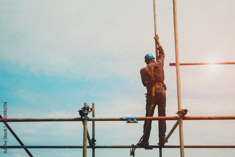 Worker on upland or high place standing on scaffolding for installed ...
