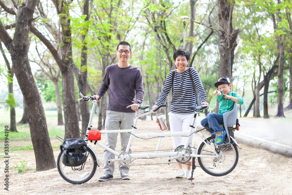 Portrait of good looking & happy Asian family (father, mother and son ...