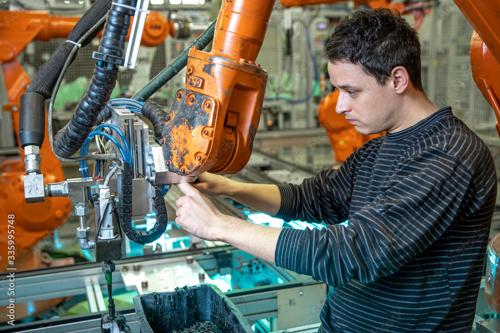 robotization of modern industry in the factory. Introduction of new ...