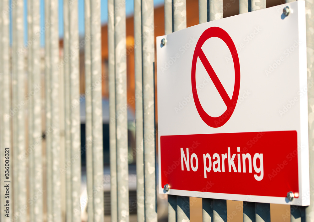 Close up view of a red & white No Parking sign attached to a metal ...