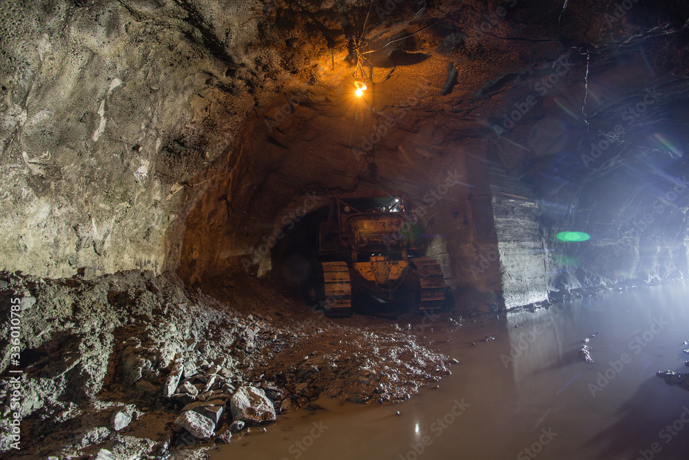 Underground gold mine shaft tunnel drift with bulldozer Stock Photo ...